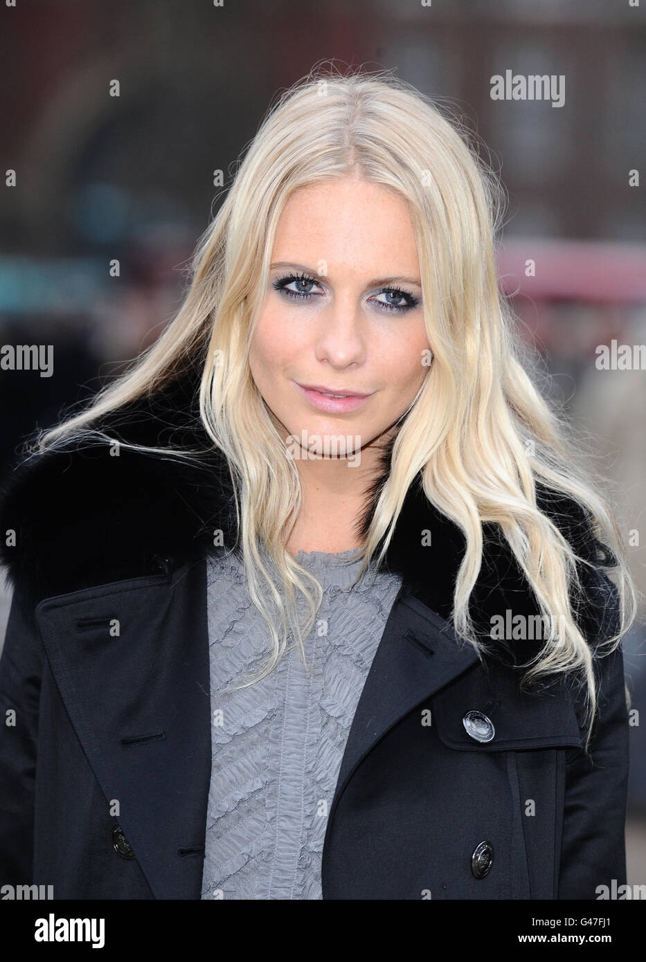 Poppy Delevingne arrives for the Burberry Fashion Show at Hyde Park in ...