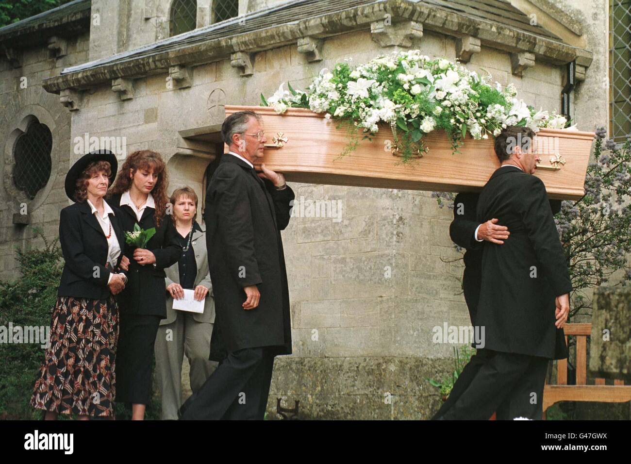 Laurie Lee's coffin is followed by his wife Cathy and daughter Jessye ...