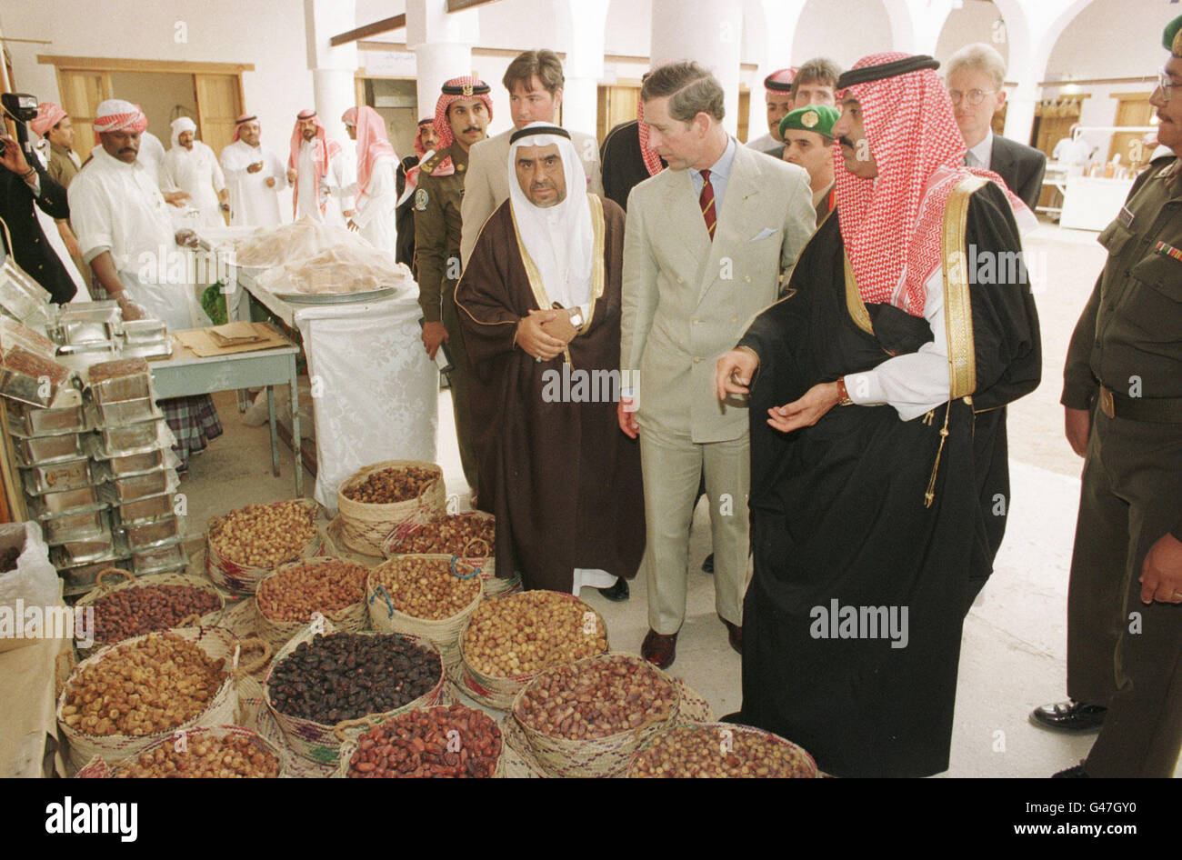 Accompanied by Saudi officials, The Prince of Wales admires the food on ...