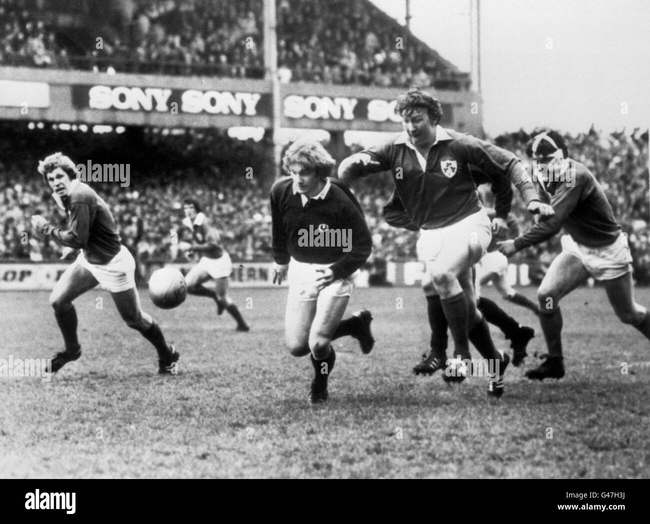Ireland's Willie Duggan, supported by Fergus Slattery (l) and Dick ...