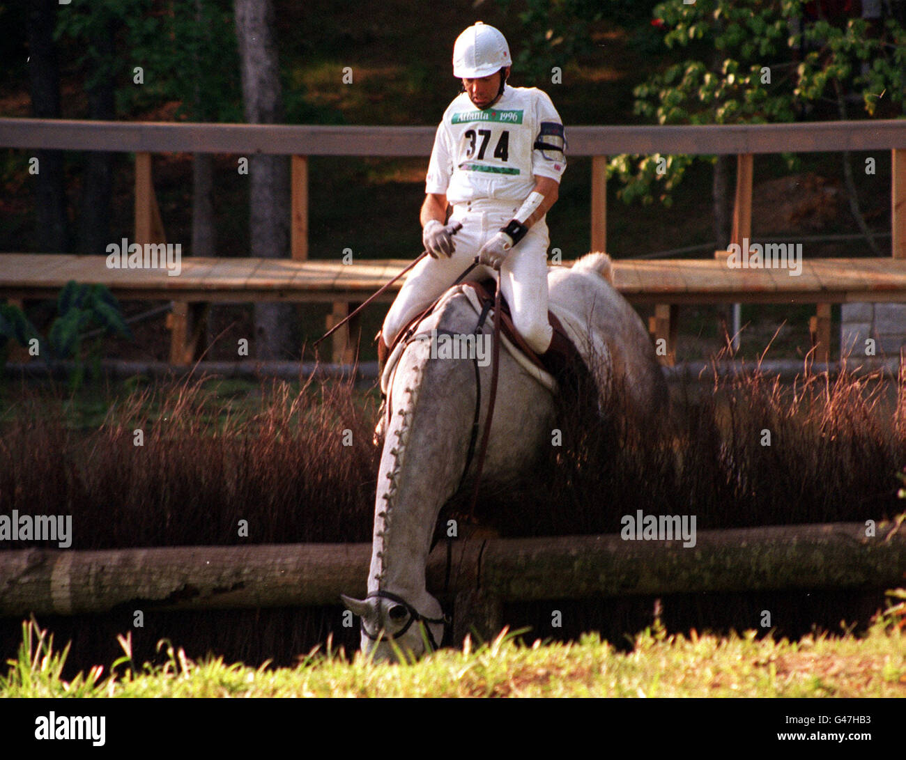 British rider Ian Stark riding Stanwick Ghost falls at the 11th fence ...