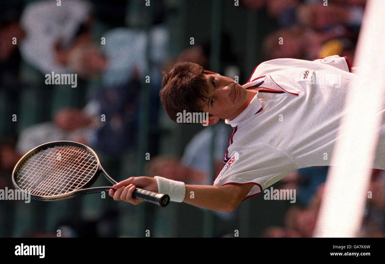 Britain's Tim Henman salutes the applause from the audience in No 1 ...