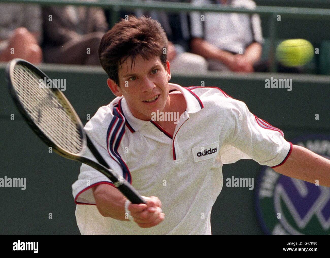 Britain's Tim Henman keeps his eye on the target during his first round ...