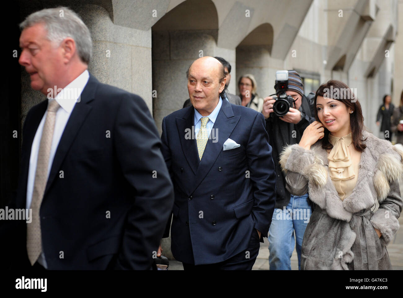 Former Polly Peck Chief Executive Asil Nadir (centre) arrives, with his ...