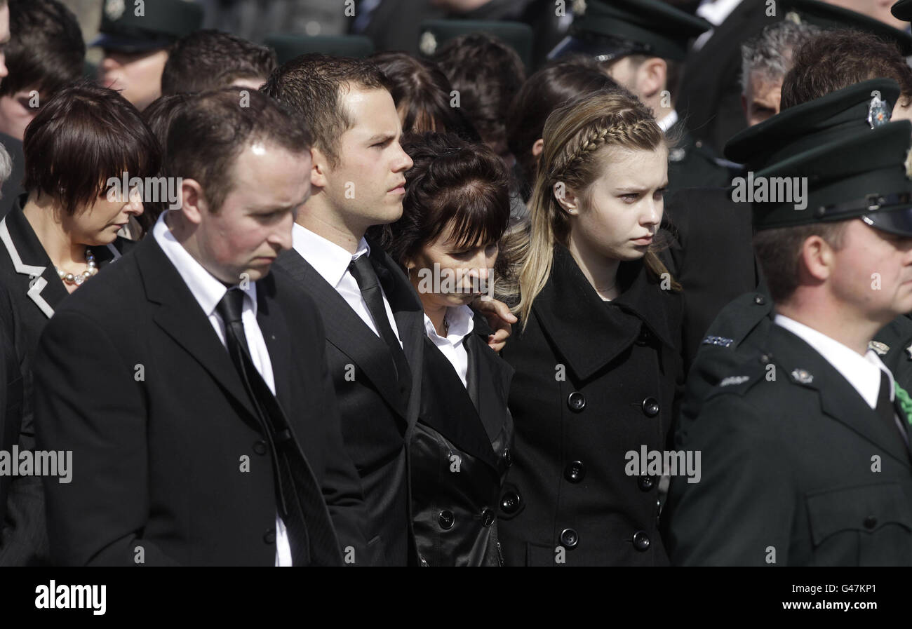 PSNI Constable Ronan Kerr's mother Nuala (centre) and family follow ...