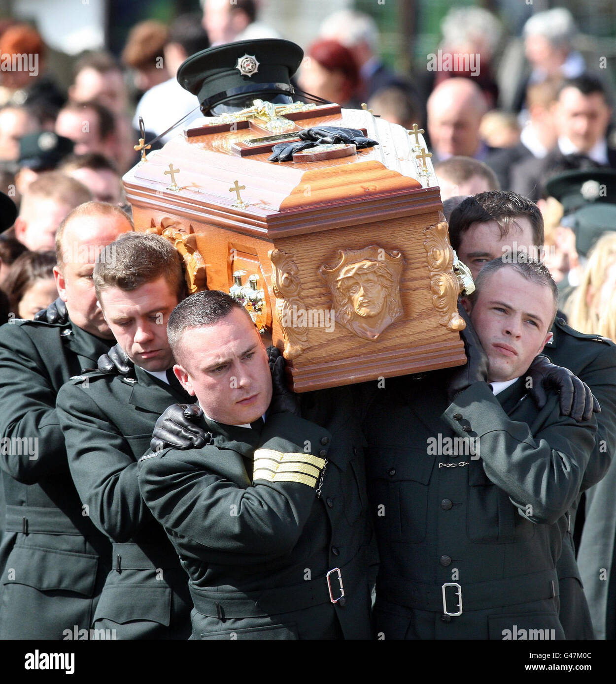 The coffin of PSNI Constable Ronan Kerr is carried through his home ...