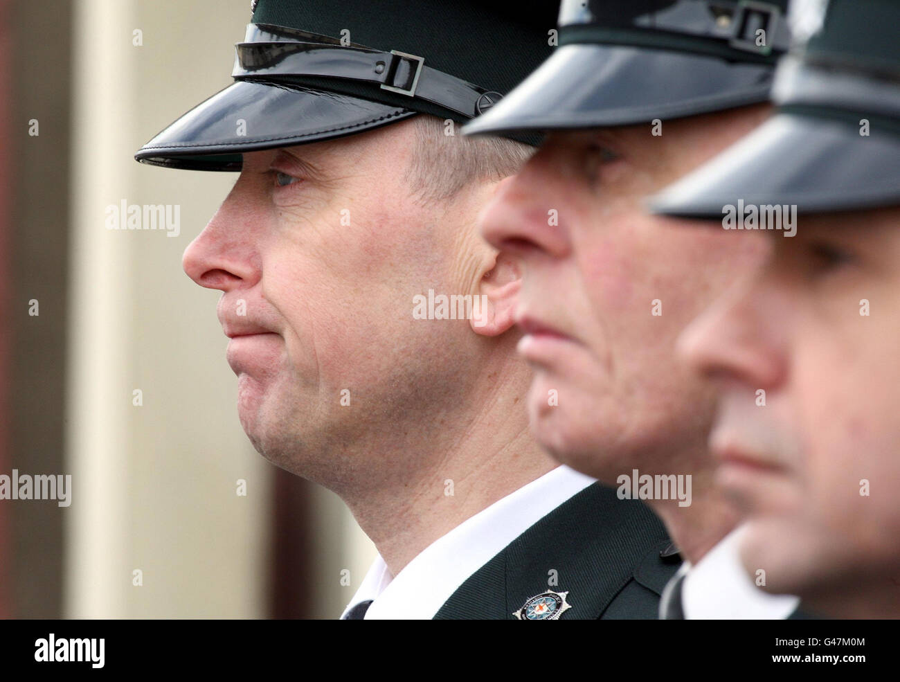 PSNI officers prepare to carry the coffin of their colleague Constable ...