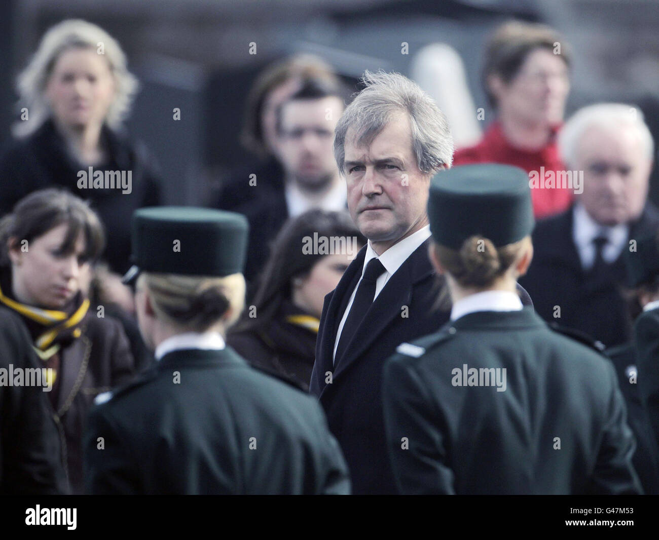 Northern Ireland secretary Owen Paterson at the funeral of PSNI ...
