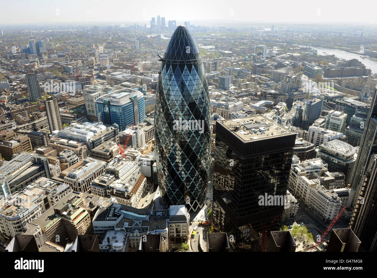 London Stock. The Gerkin with Canary Wharf in the distance, seen from ...