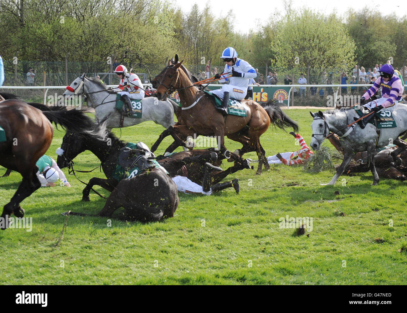 Several horses fall at Bechers Brook in the John Smith Grand National ...