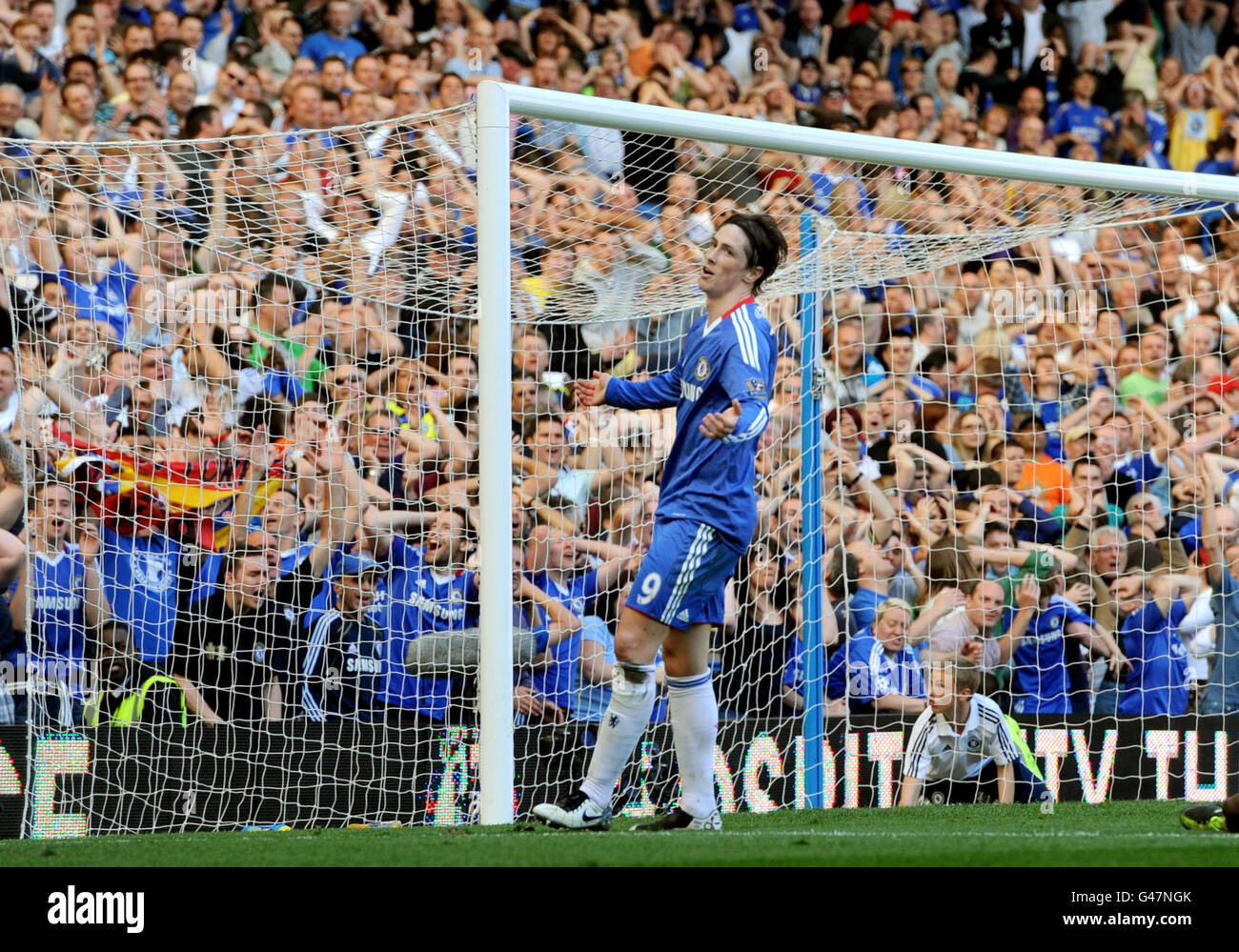 Chelsea's Fernando Torres reacts after his shot on goal is saved by ...