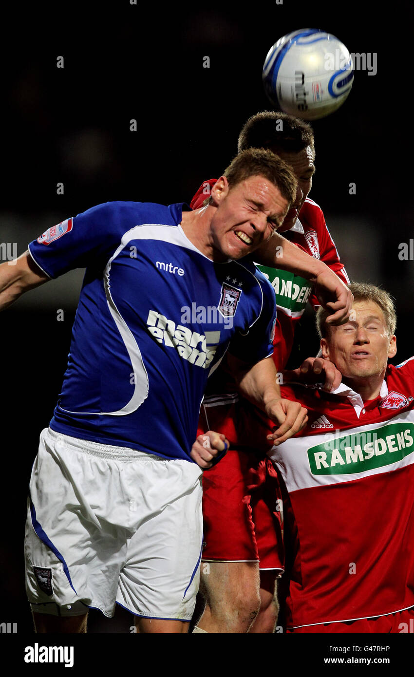 Ipswich Town's Connor Wickham and Middlesbrough's Tony McMahon compete ...