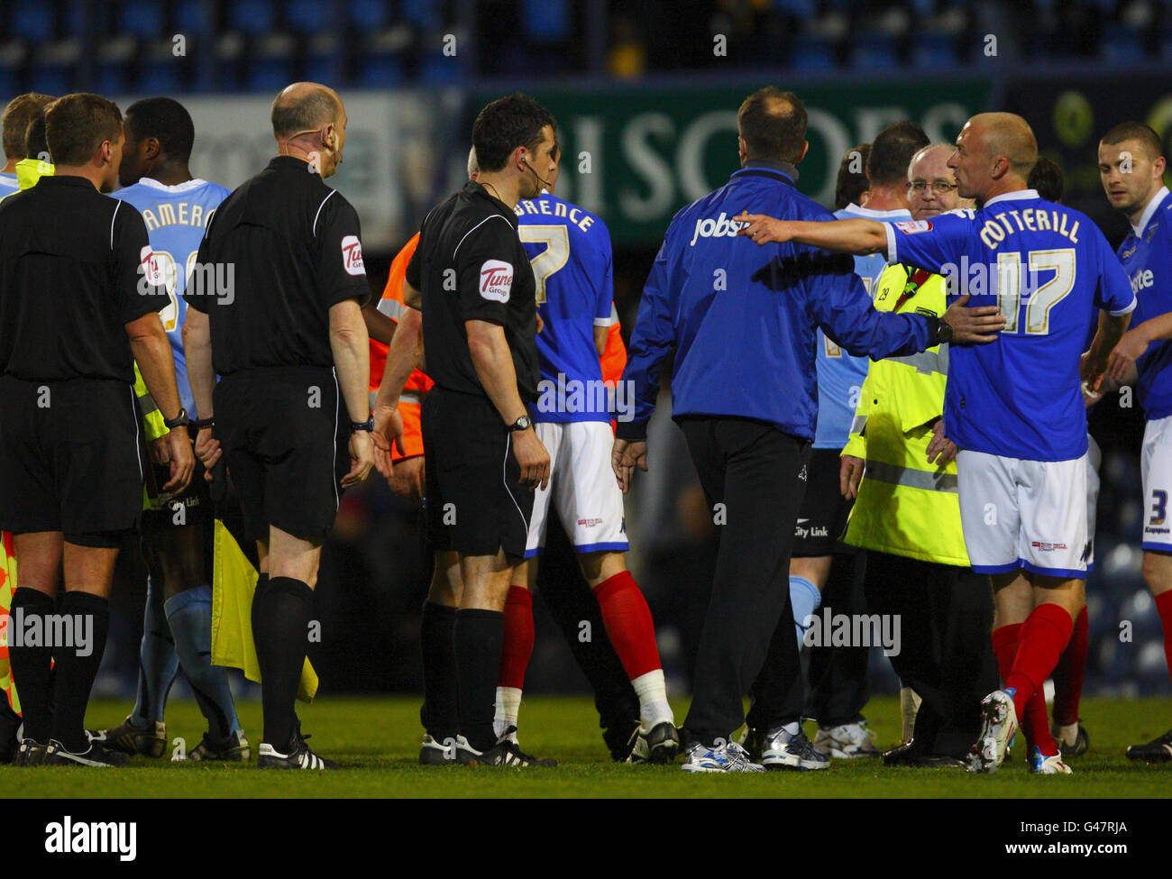Portsmouth's David Cotterill points a finger at referee Dean Whitestone ...