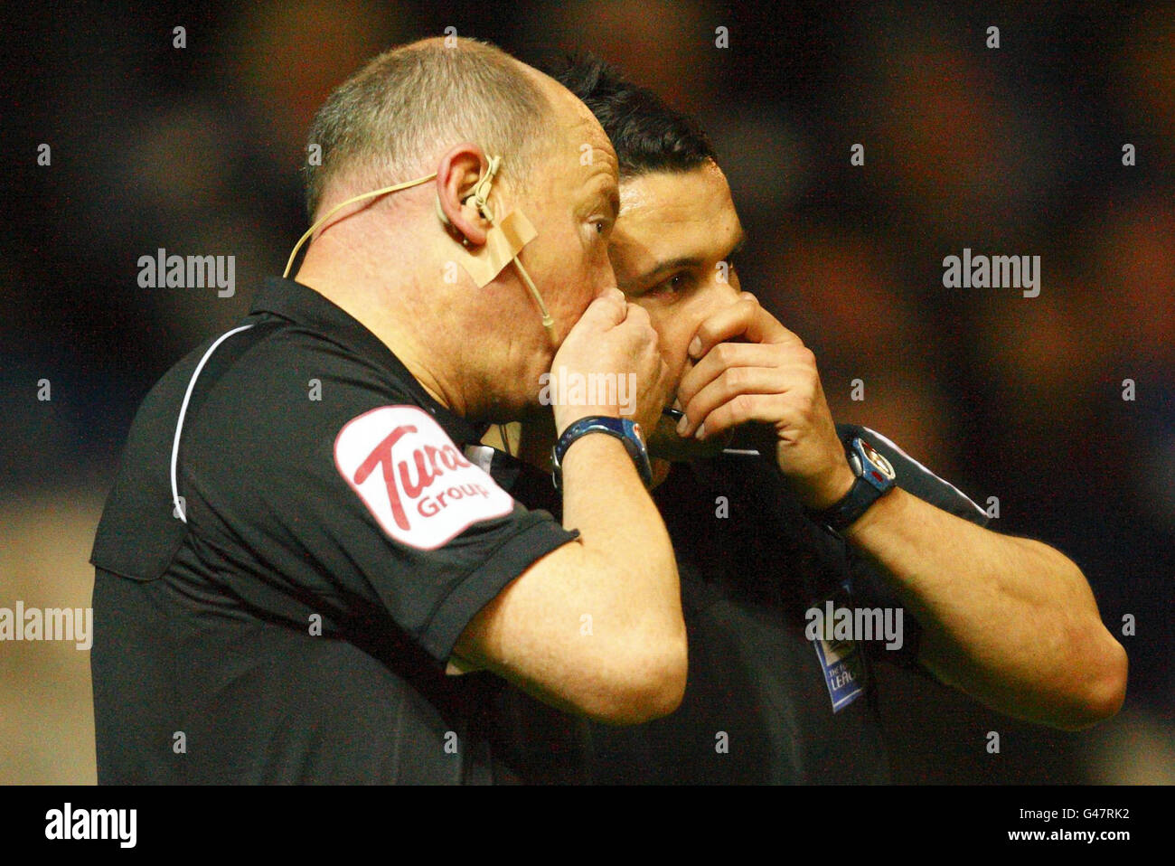 Referee Dean Whitestone (right) consults with his assistant Steve ...