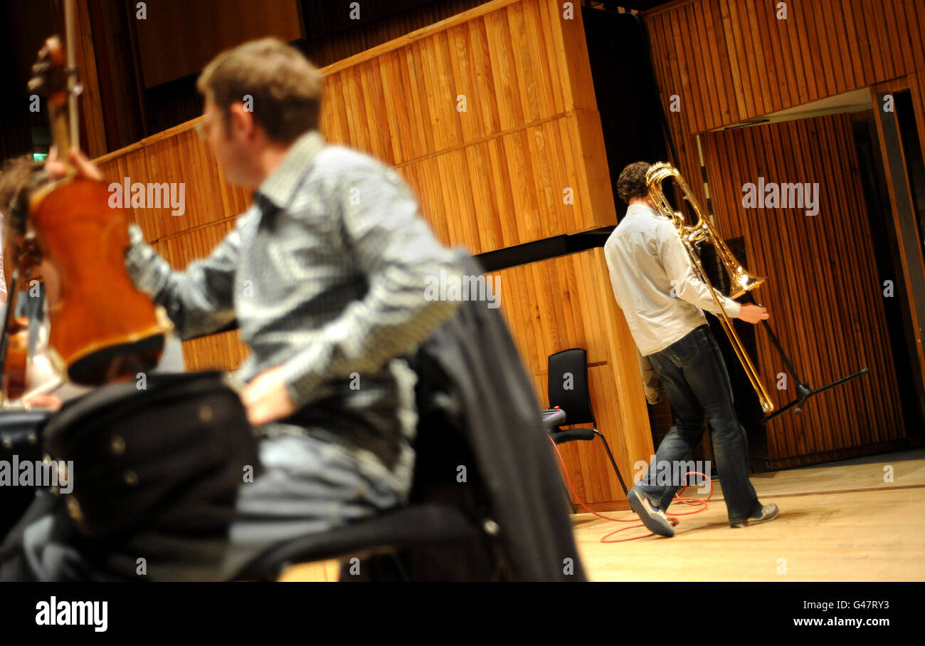 Musicians pack up their instruments as the orchestra selected to record ...