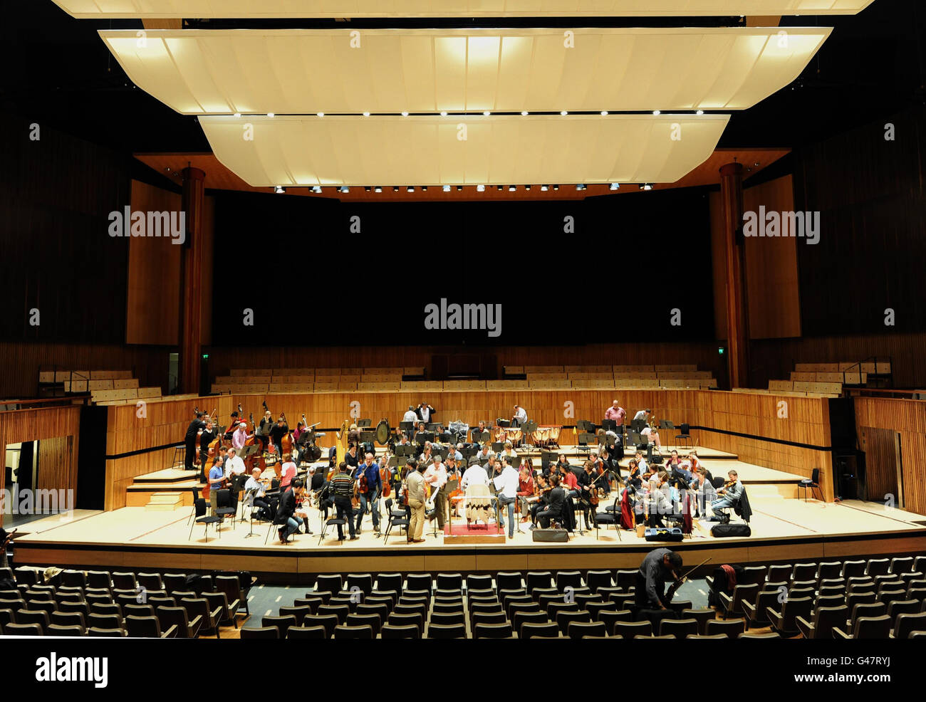 Musicians pack up their instruments as the orchestra selected to record ...