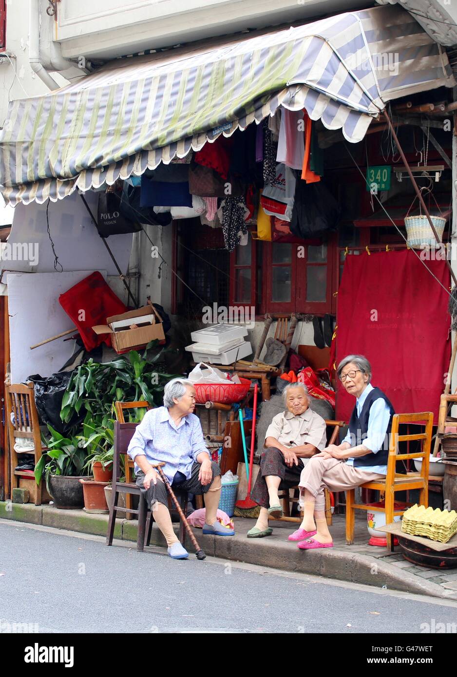 Three local Shanghai residents extending their living room on to the ...