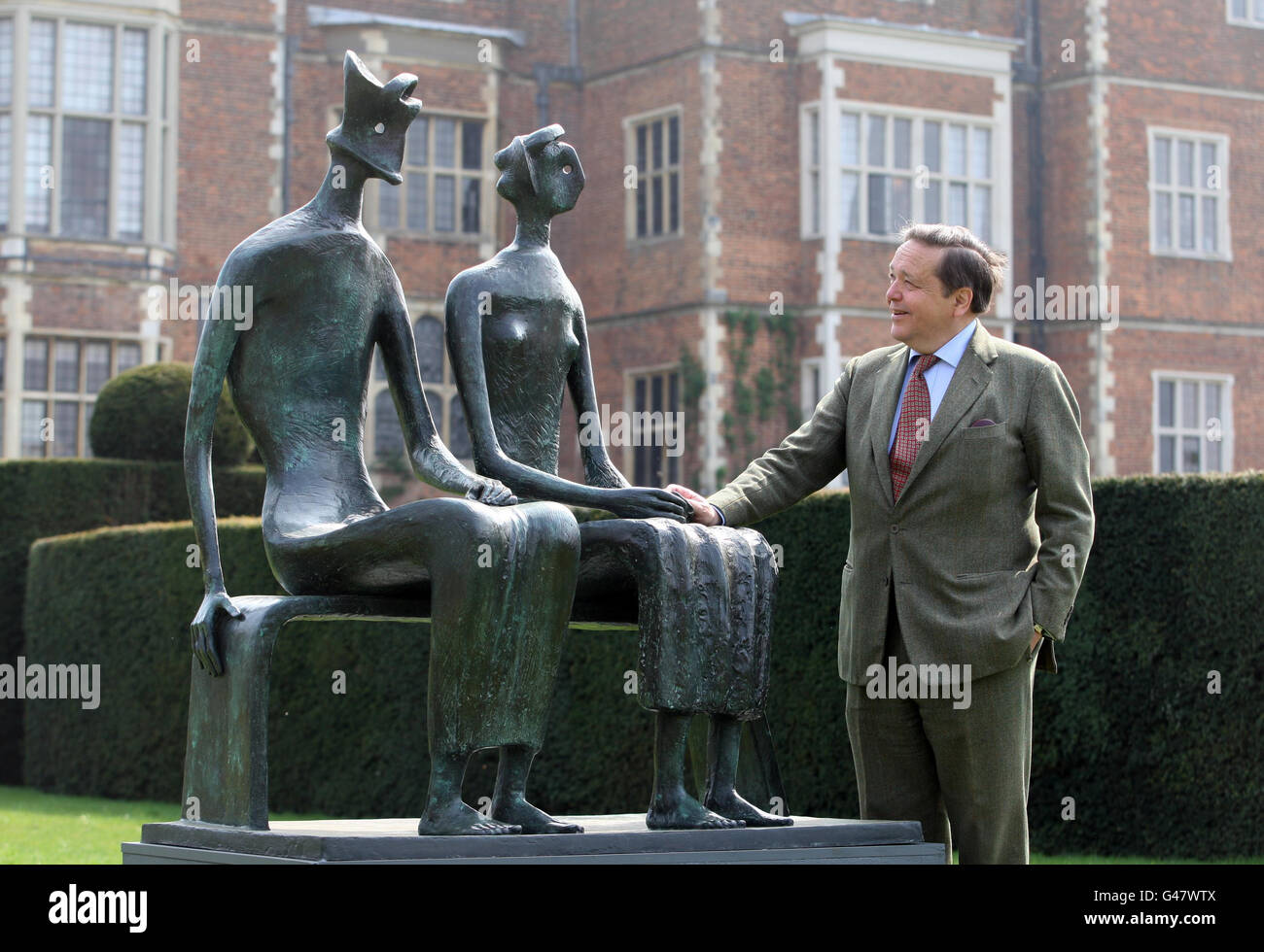 Lord Salisbury looks at Henry Moore's King and Queen, at the opening of ...