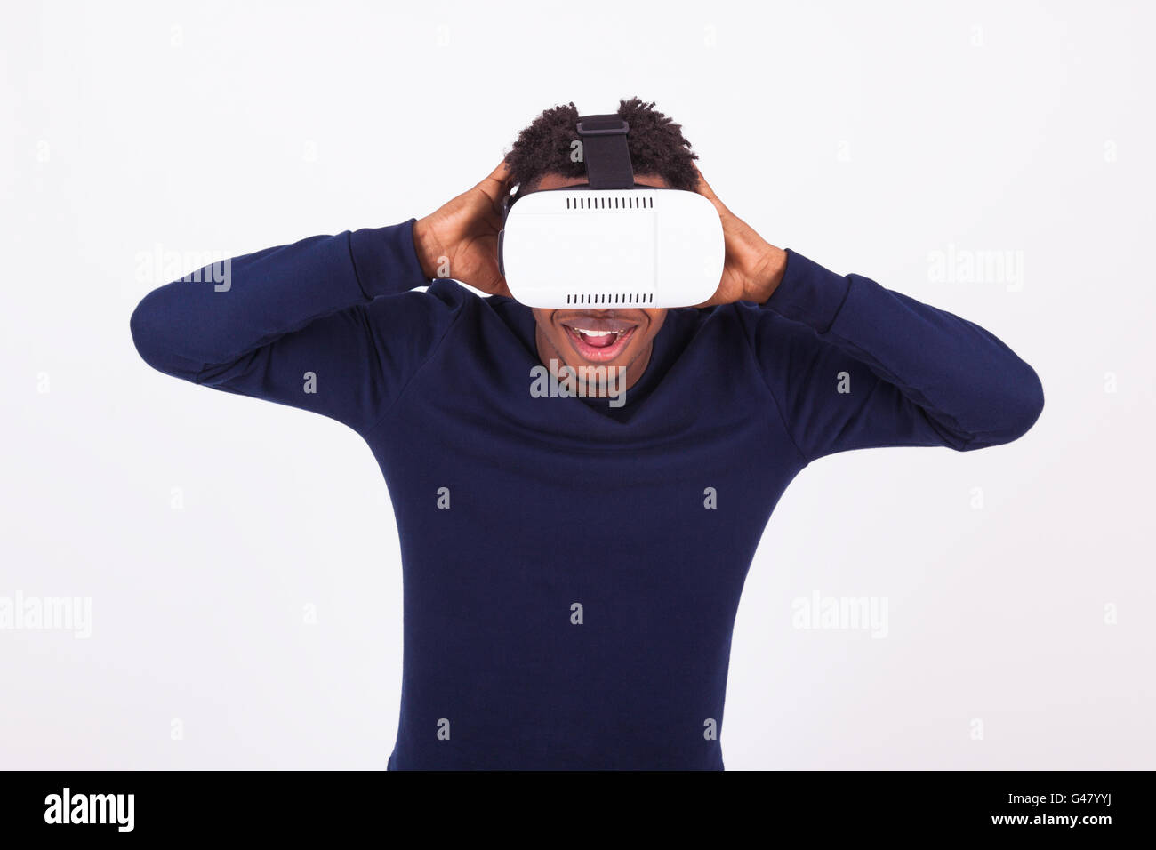 African American young man wearing vr virtual reality headset over ...