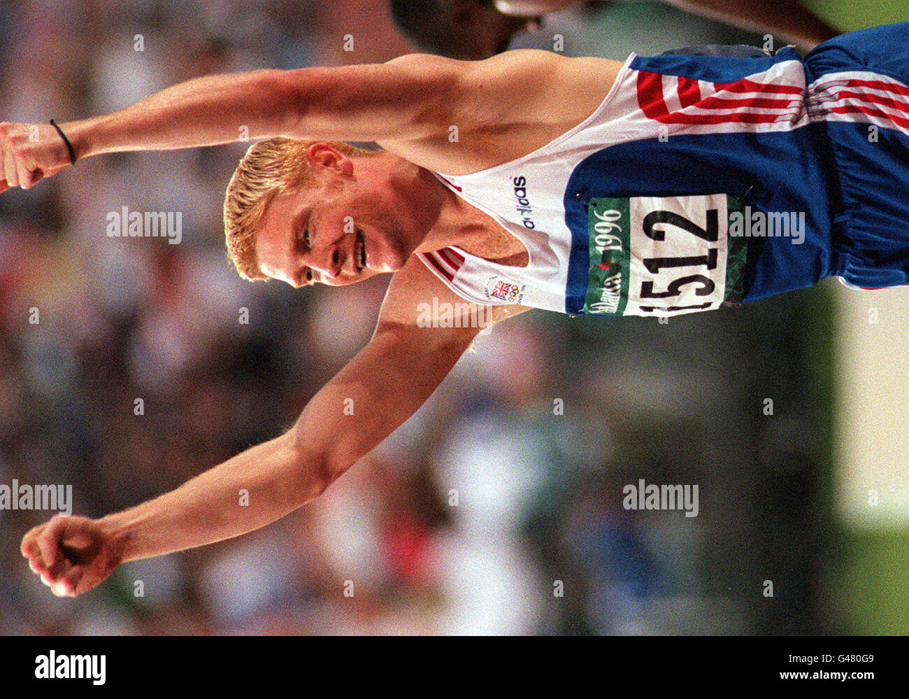 Britain's Iwan Thomas celebrates in the Olympic Stadium this evening ...