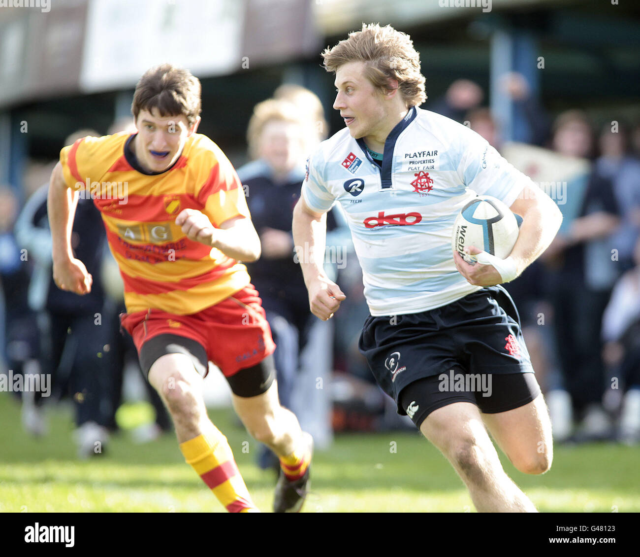 Edinburgh Academical's Sam Atkin (right) runs in the winning try ...
