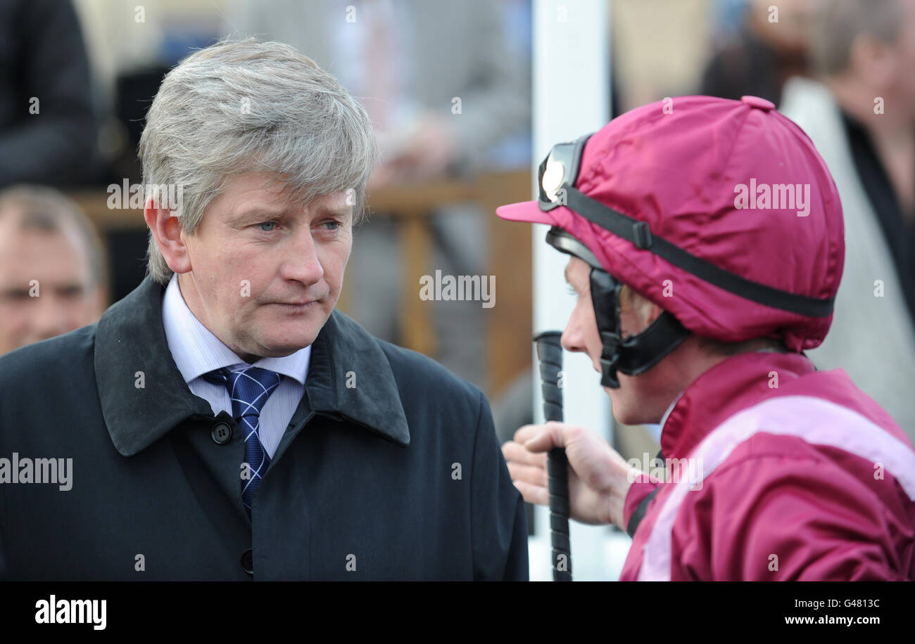 Trainer John Quinn talks to jockey Paul Hanagan after his victory in ...