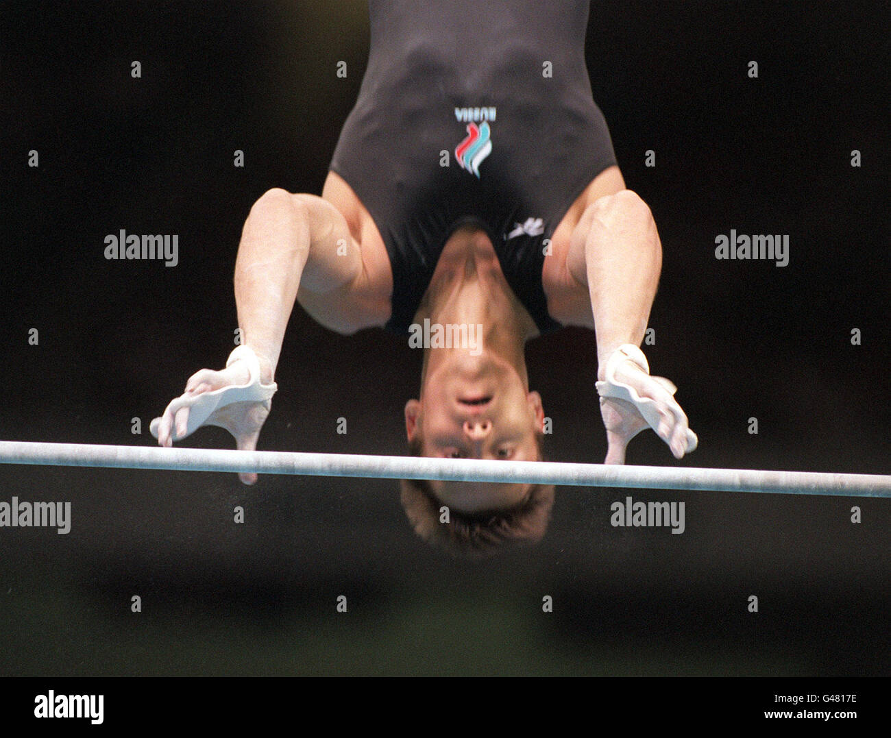 Russia's Dimitry Trush releases from the high bar during one of his ...