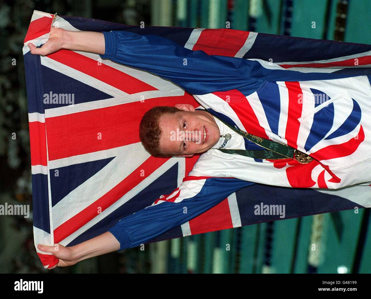 Britain's Graeme Smith celebrating with the Union Jack this evening ...