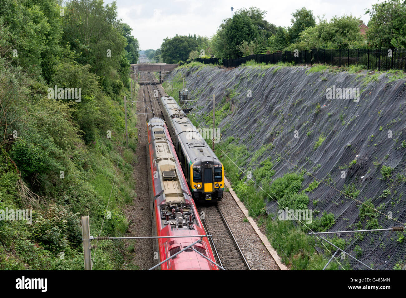 Electric trains passing on West Coast Main Line at Cheylesmore ...