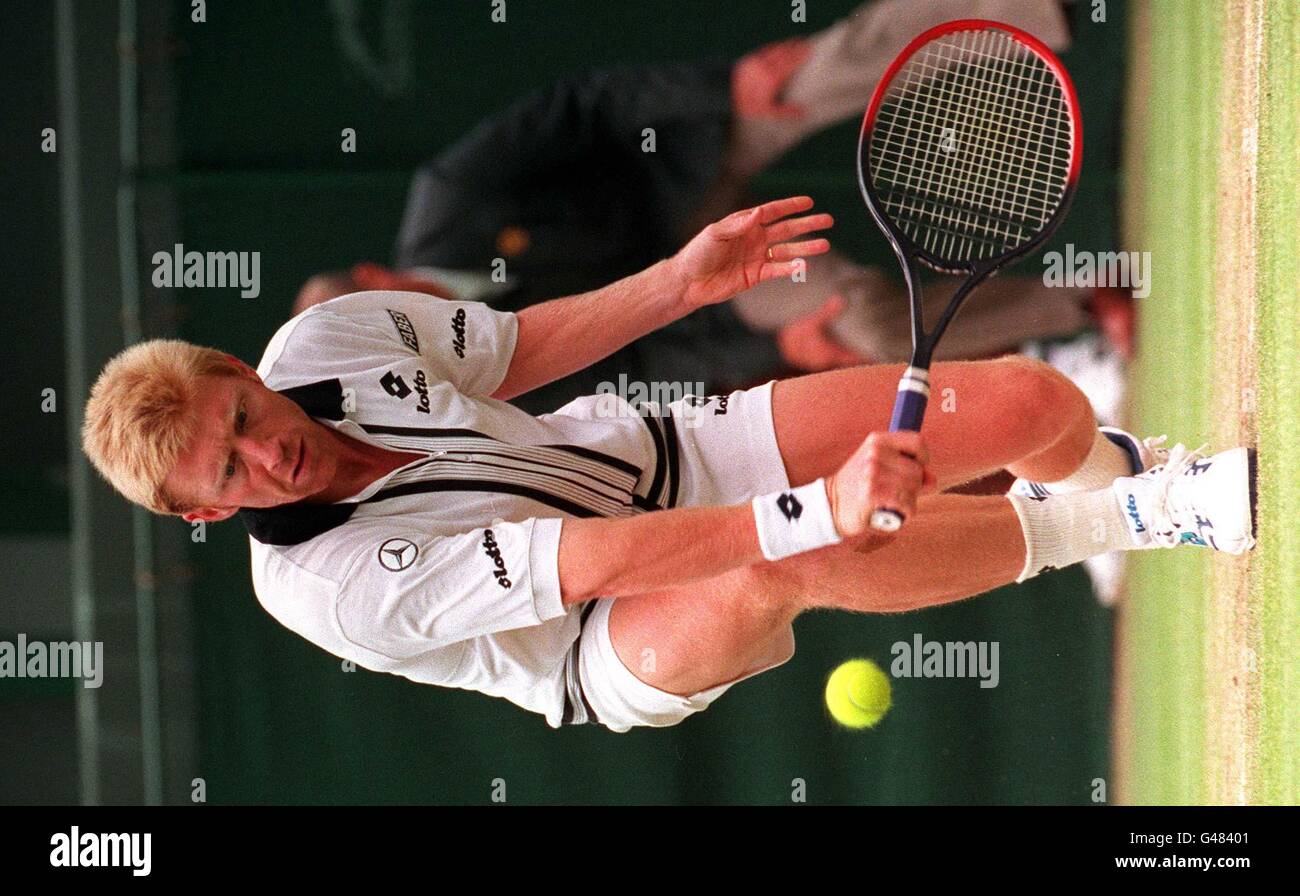 Germany's Boris Becker bends for a low backhand to Britain's Mark ...