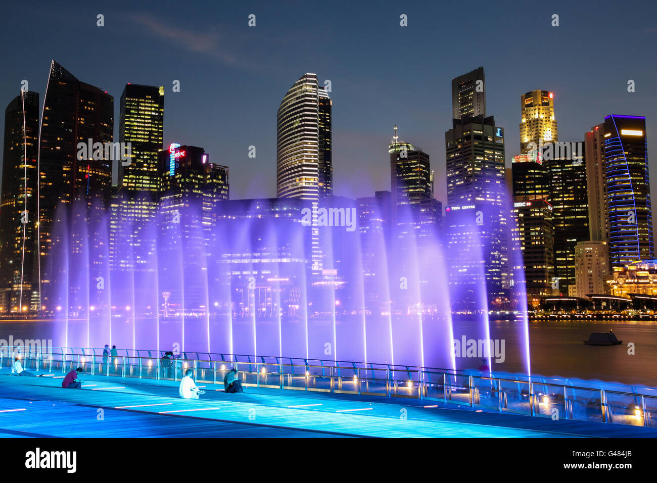 SINGAPORE - APRIL 7 : A crowd gathers to watch illuminated water ...