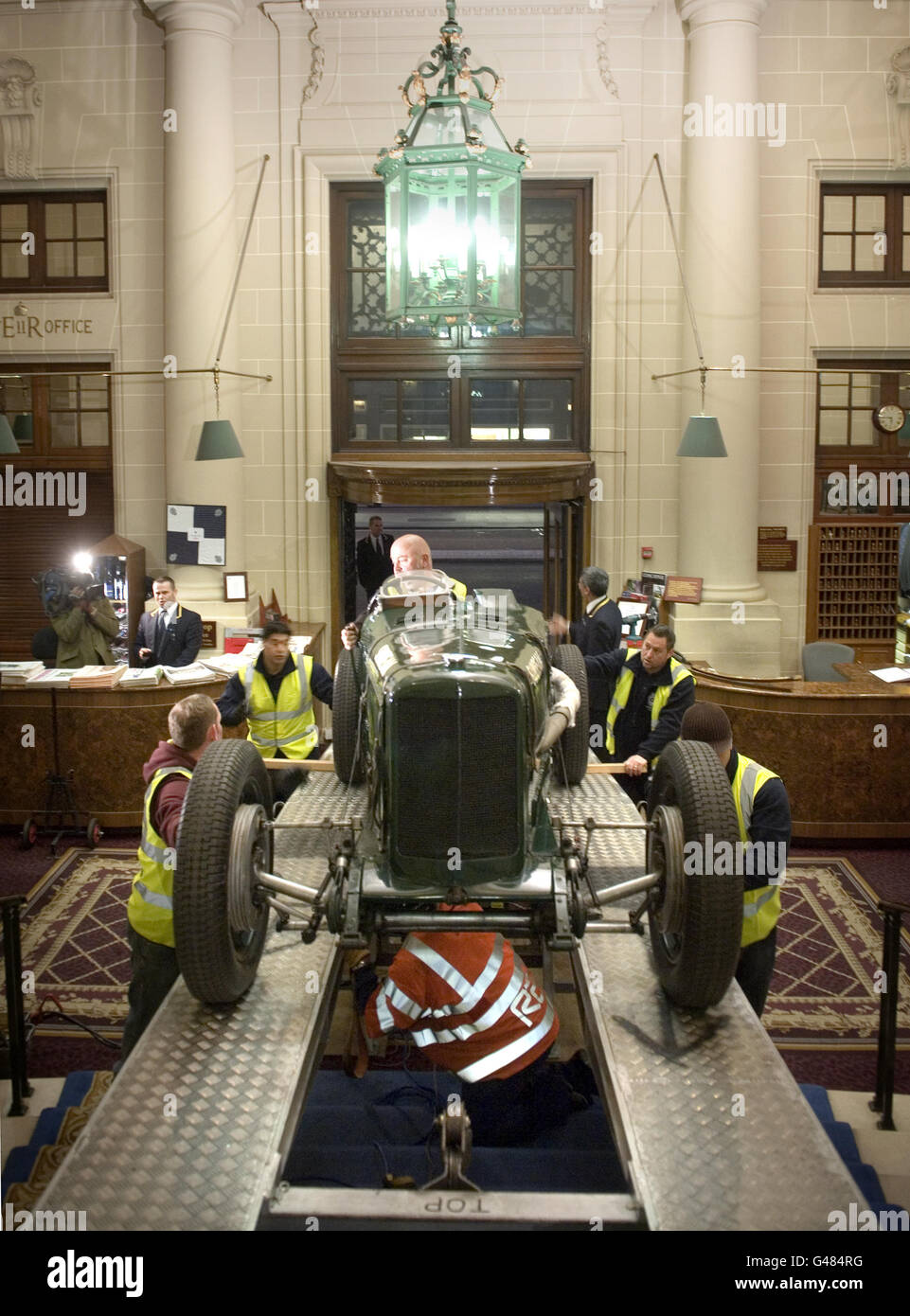 The 1924 Grand Prix Sunbeam 'Cub' is wheeled into the RAC club ...