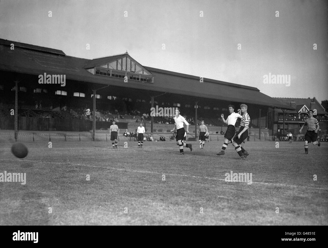 Ernie Shepherd (centre), playing in first team colours, scores his ...