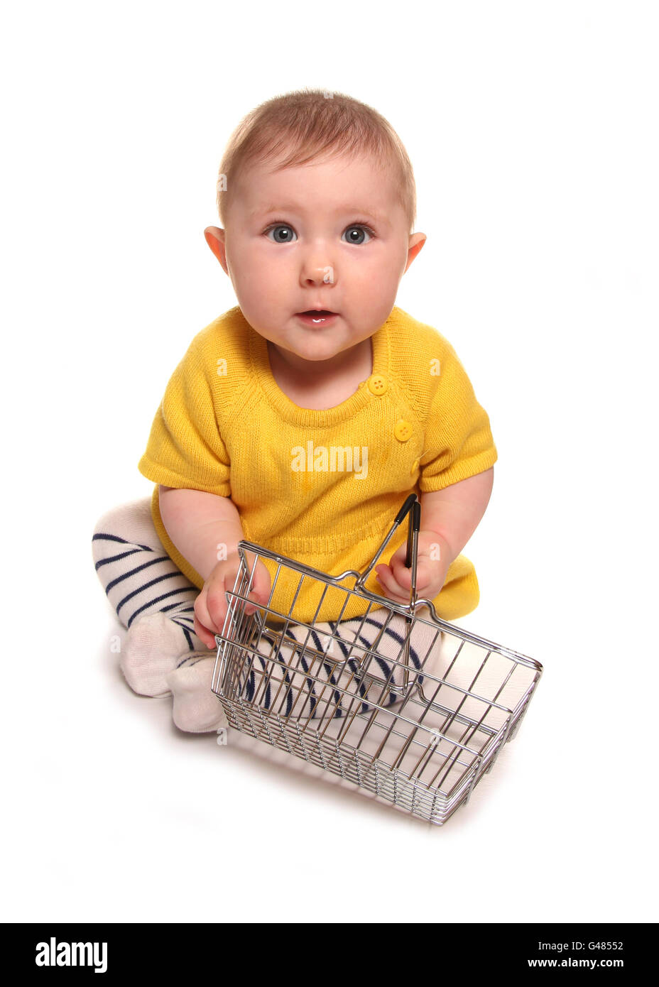 Baby girl with shopping basket cutout Stock Photo - Alamy