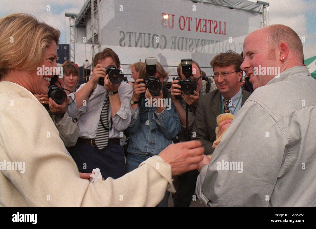 Model Paula Hamilton poses for the media with ferret handler Scott ...