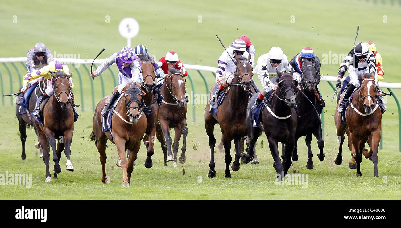 Genki and jockey Steve Drowne (second left) go on to win the Connaught ...