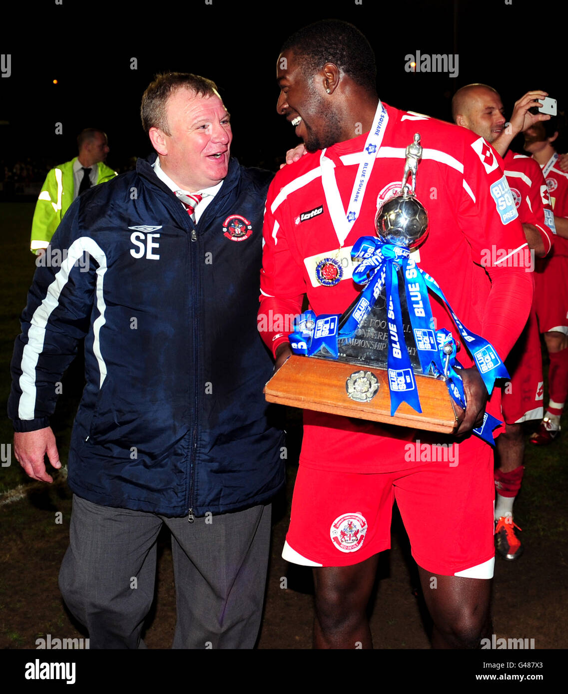 Crawley Town manager Steve Evans (left) shares a joke with Pablo Mills ...