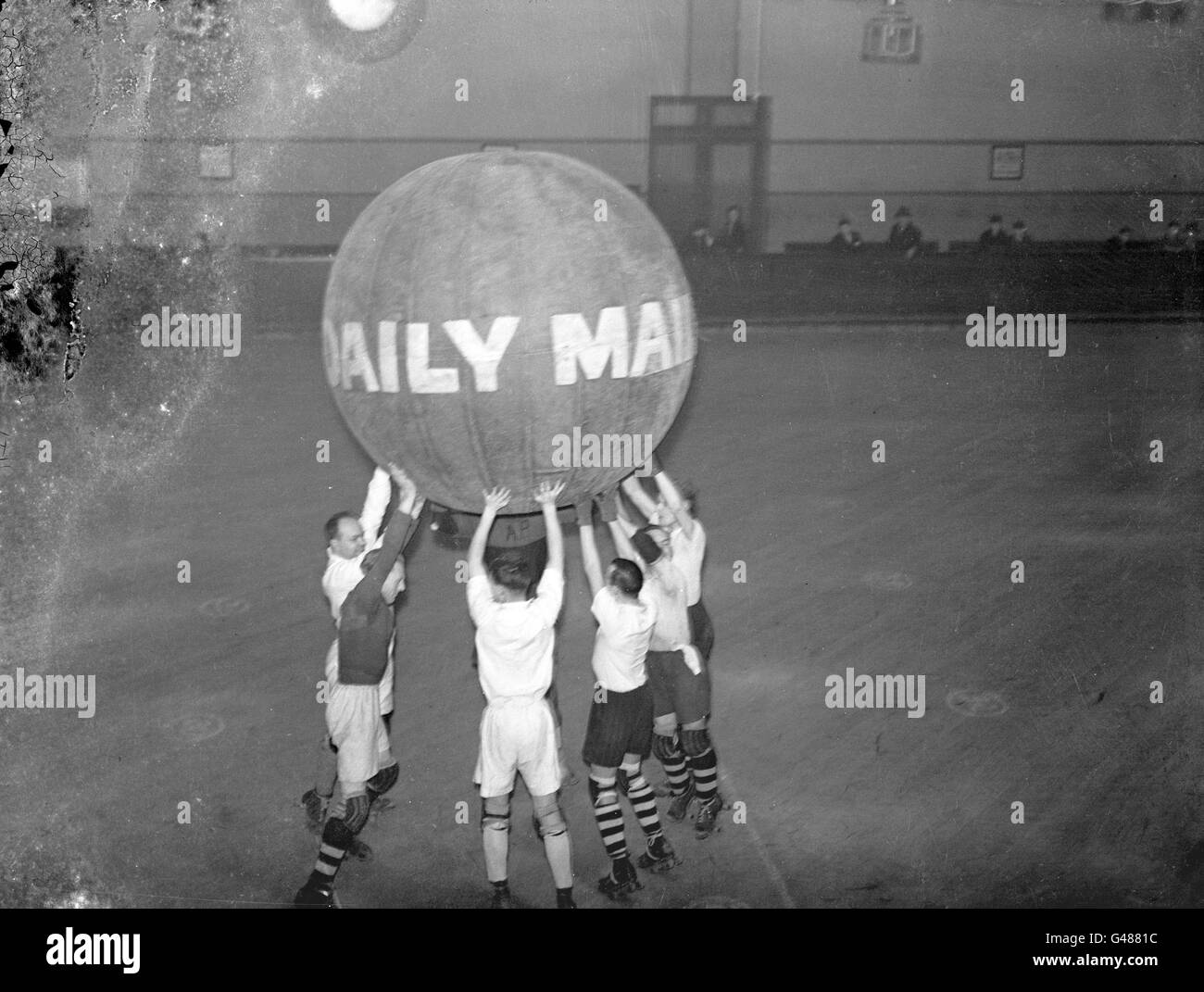 Roller skating Pushball players in action. The game was played with a ...