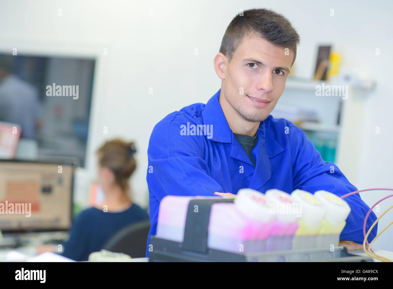 man and ink containers Stock Photo - Alamy