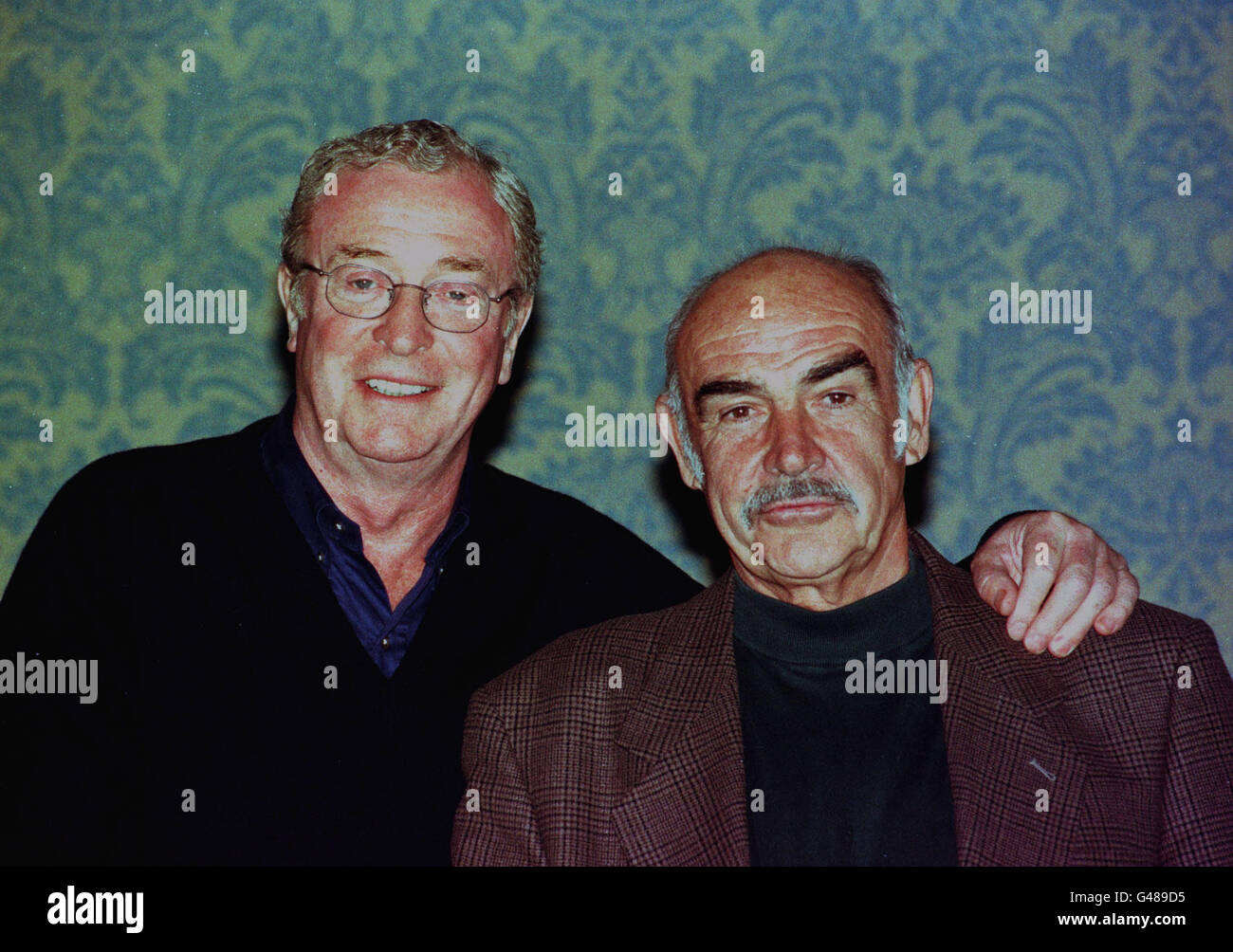 Actors Michael Caine and Sean Connery pose for cameras at a photocall ...