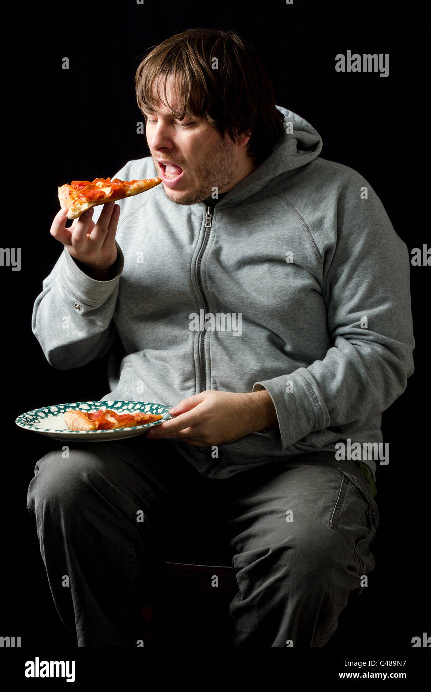 After exercise this fat guy is eating a pizza. Without proper diet ...