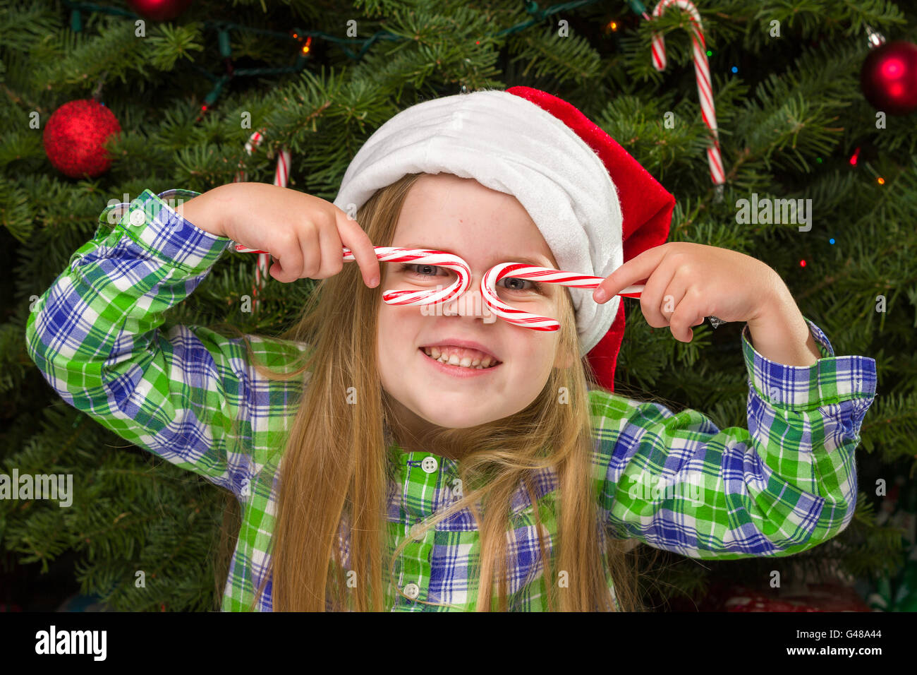 She is making candy cane eye glasses Stock Photo - Alamy