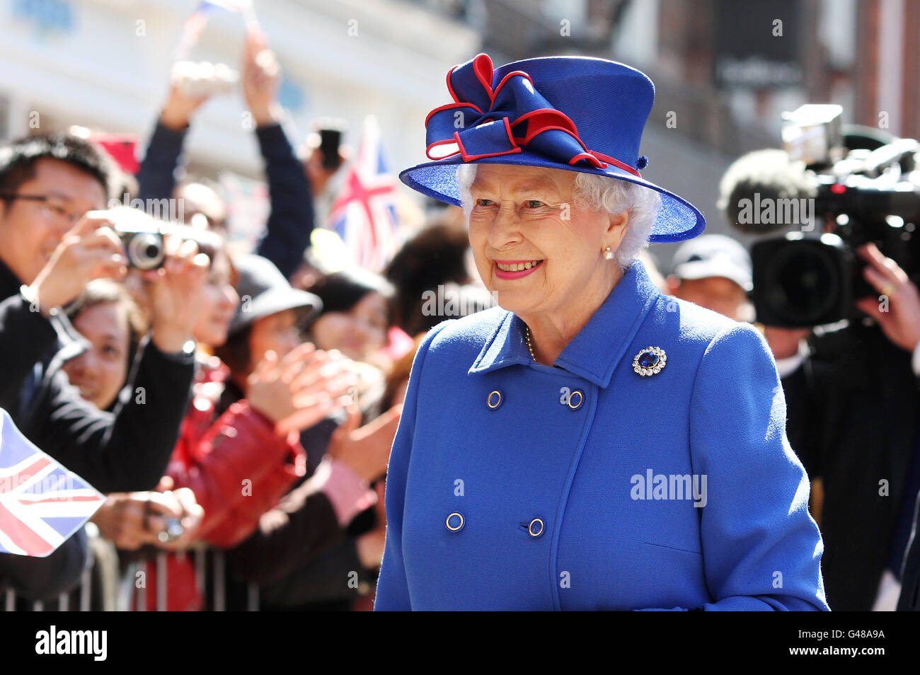 Queen Elizabeth II is greeted by crowds on her arrival at St John's ...