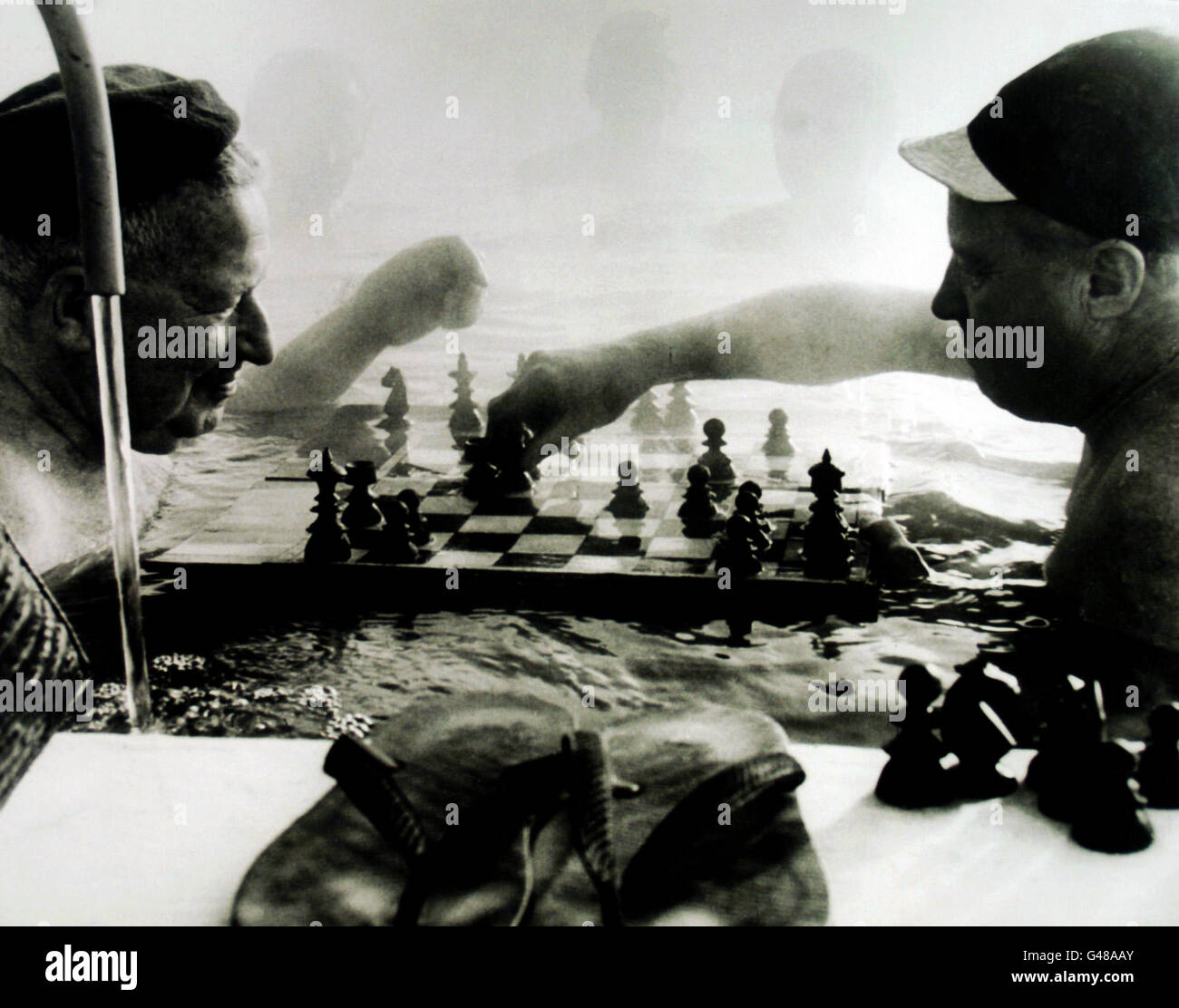 Two gentlemen enjoy their game of chess in the hot pool of the Liberty ...
