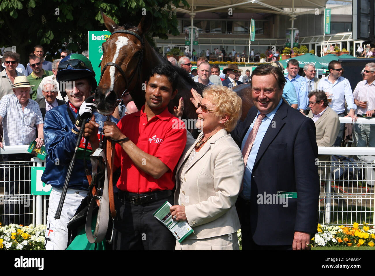Jockey Tony McCoy (left) and trainer Nicky Henderson (right) pose for a ...