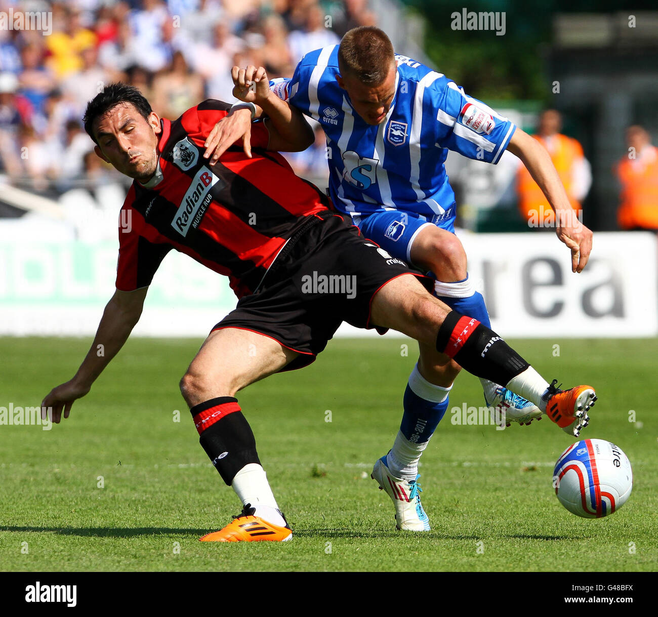 Huddersfield's Gary Roberts (left) in action against Brighton's Craig ...