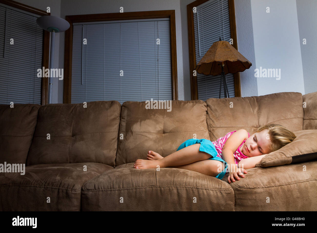 Curled Up Girl High Resolution Stock Photography and Images - Alamy
