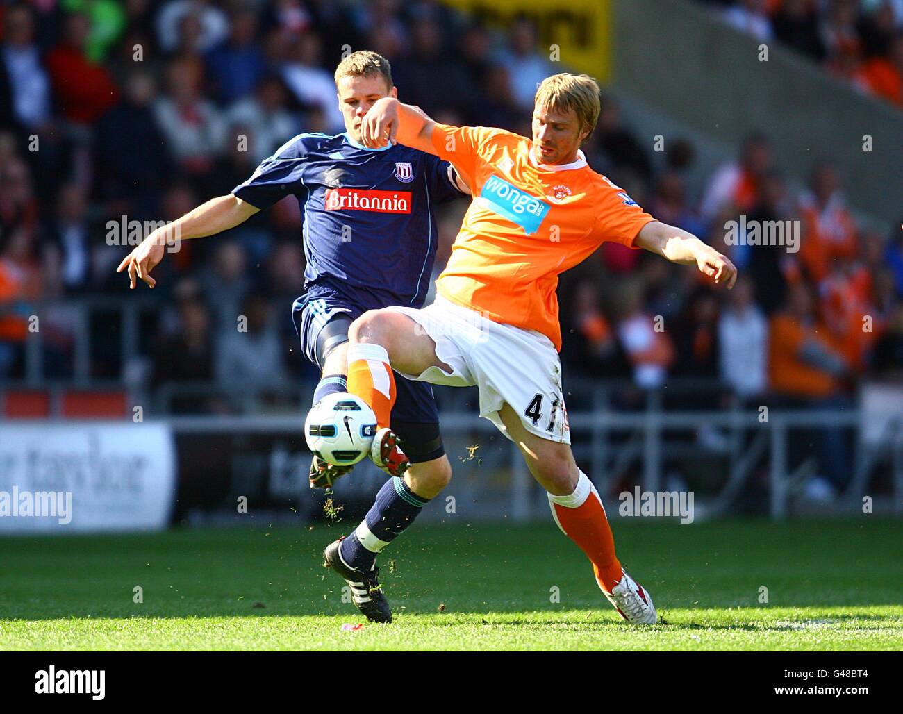 Stoke City's Ryan Shawcross (left) and Blackpool's Sergey Kornilenko battle for the ball Stock ...