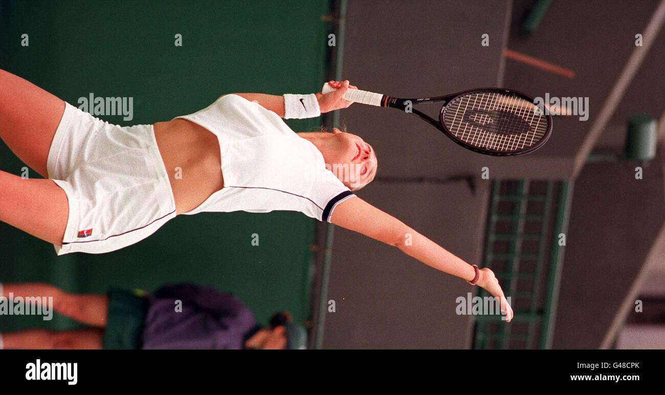France's Mary Pierce prepares to serve to Belgium's Dominique Van Roost ...