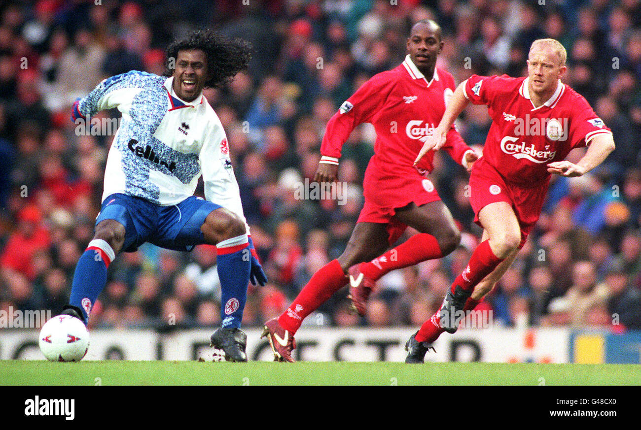 Liverpool's Mark Wright (right) and Michael Thomas keep an eye on ...